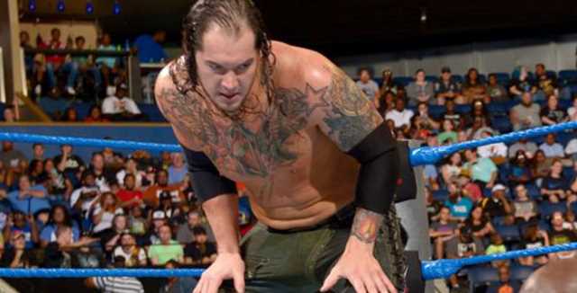WWE's Baron Corbin Takes Down A Fan Who Made Fun Of His Receding ...